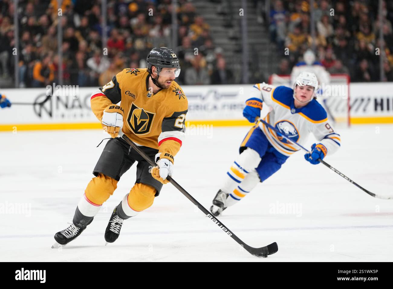 Vegas Golden Knights defenseman Shea Theodore (27) skates with the puck ...