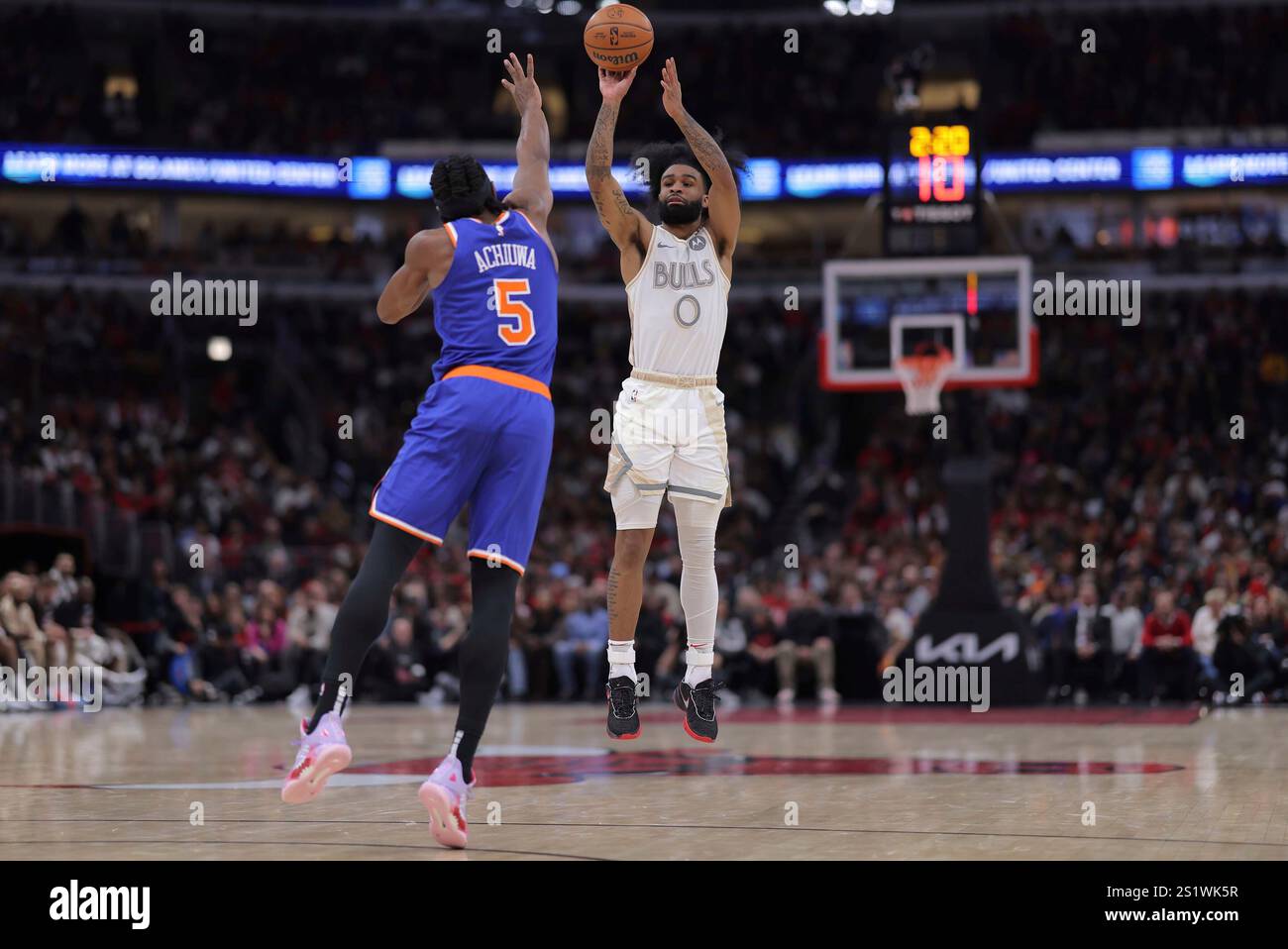 Chicago Bulls guard Coby White (0) shoots a 3-point basket over New ...