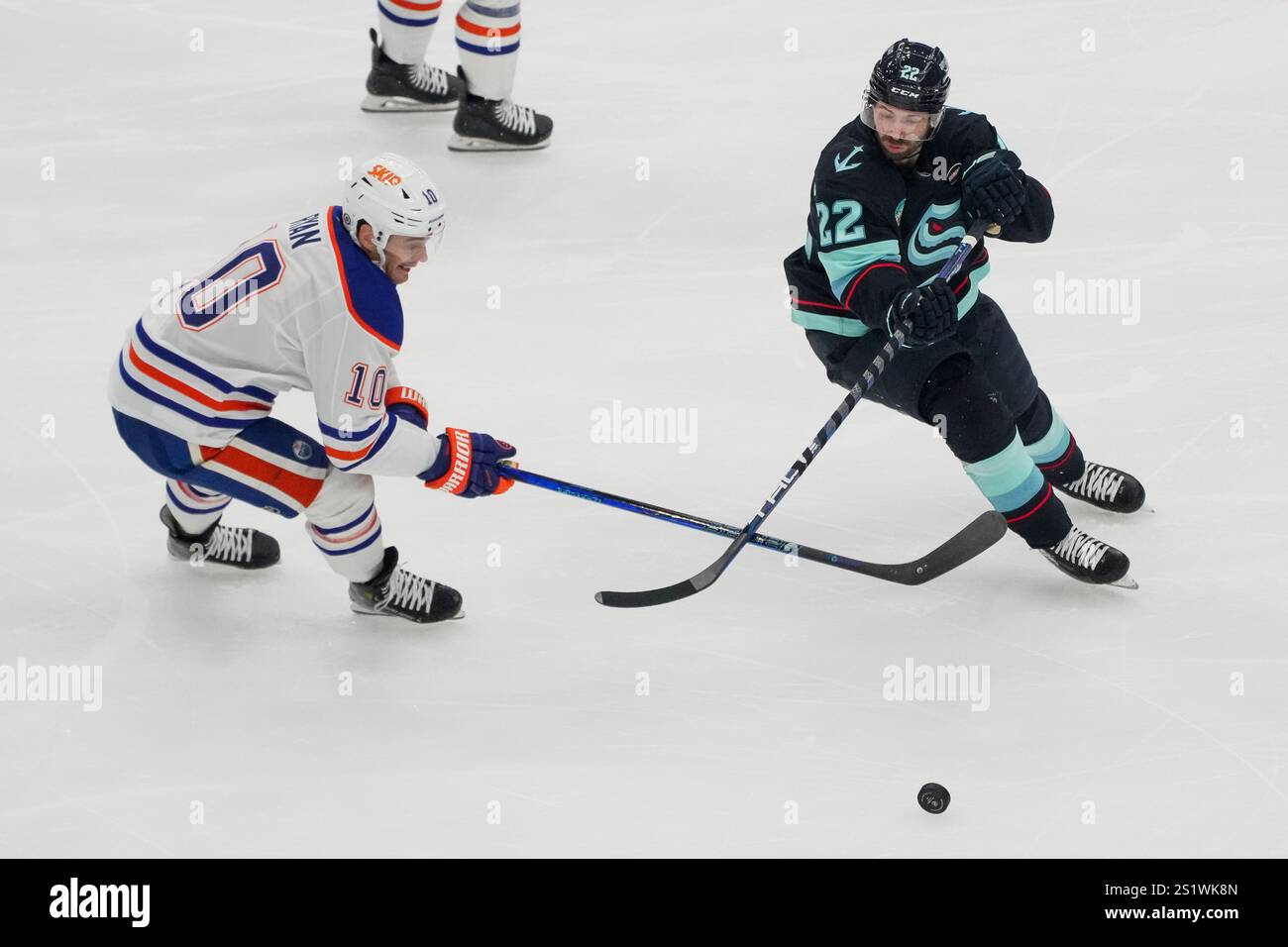 Seattle Kraken right wing Oliver Bjorkstrand, right, vies for the puck ...
