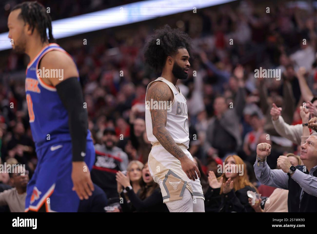 Chicago Bulls guard Coby White, center, looks into the crowd after ...