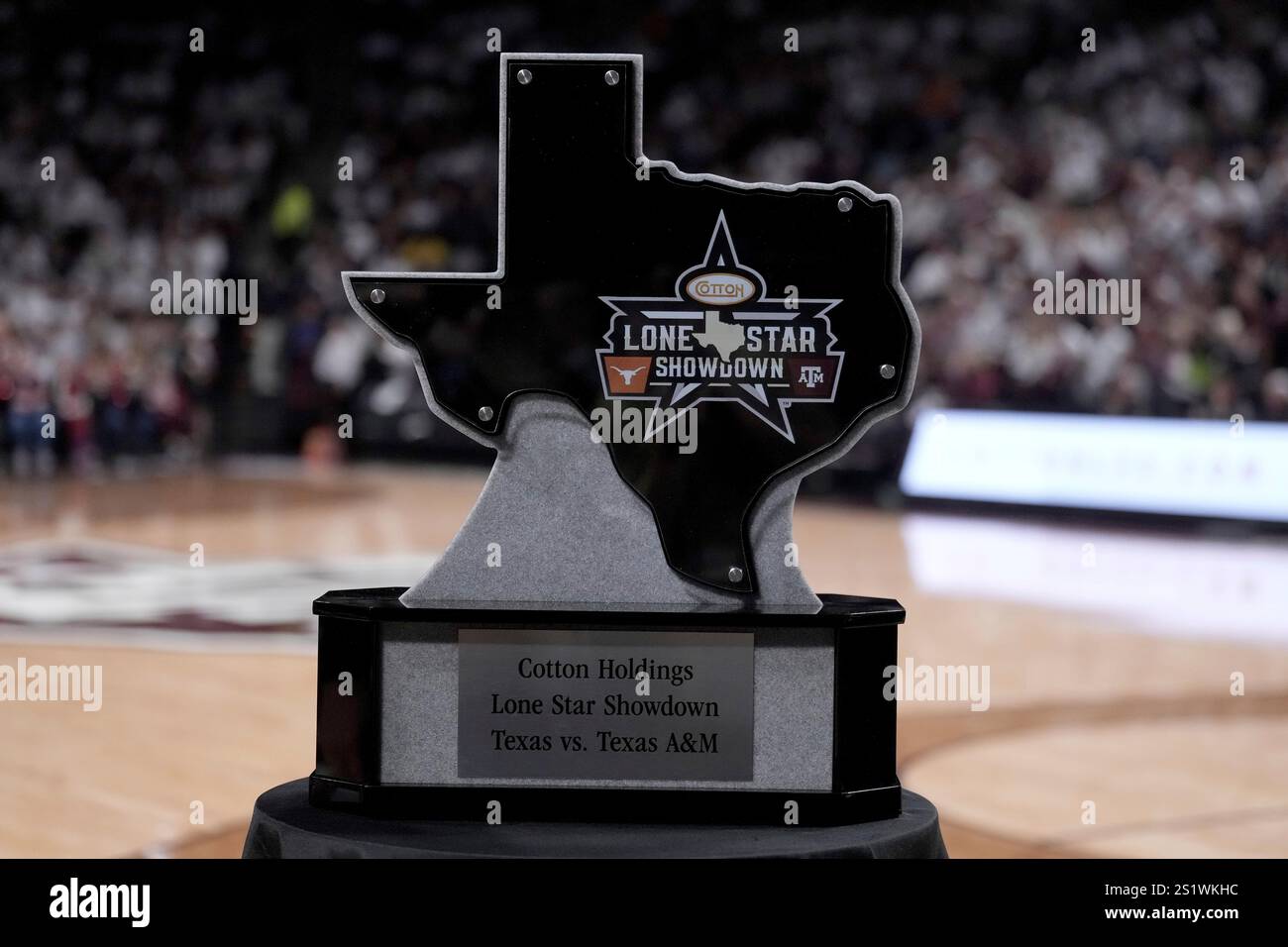 The Lone Star Showdown trophy sits on the court at Reed Arena before ...