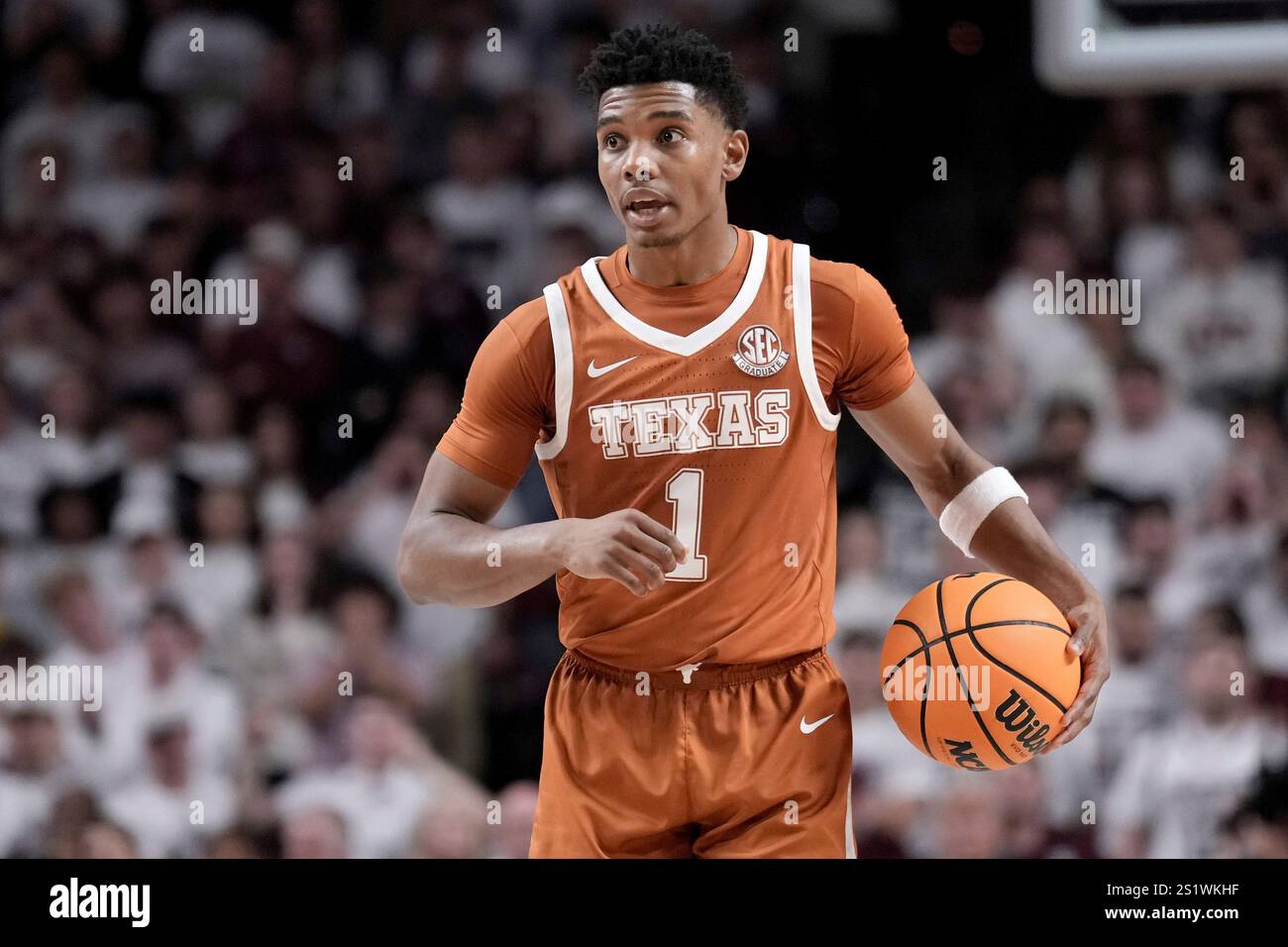 Texas guard Julian Larry (1) brings the ball down the court against ...