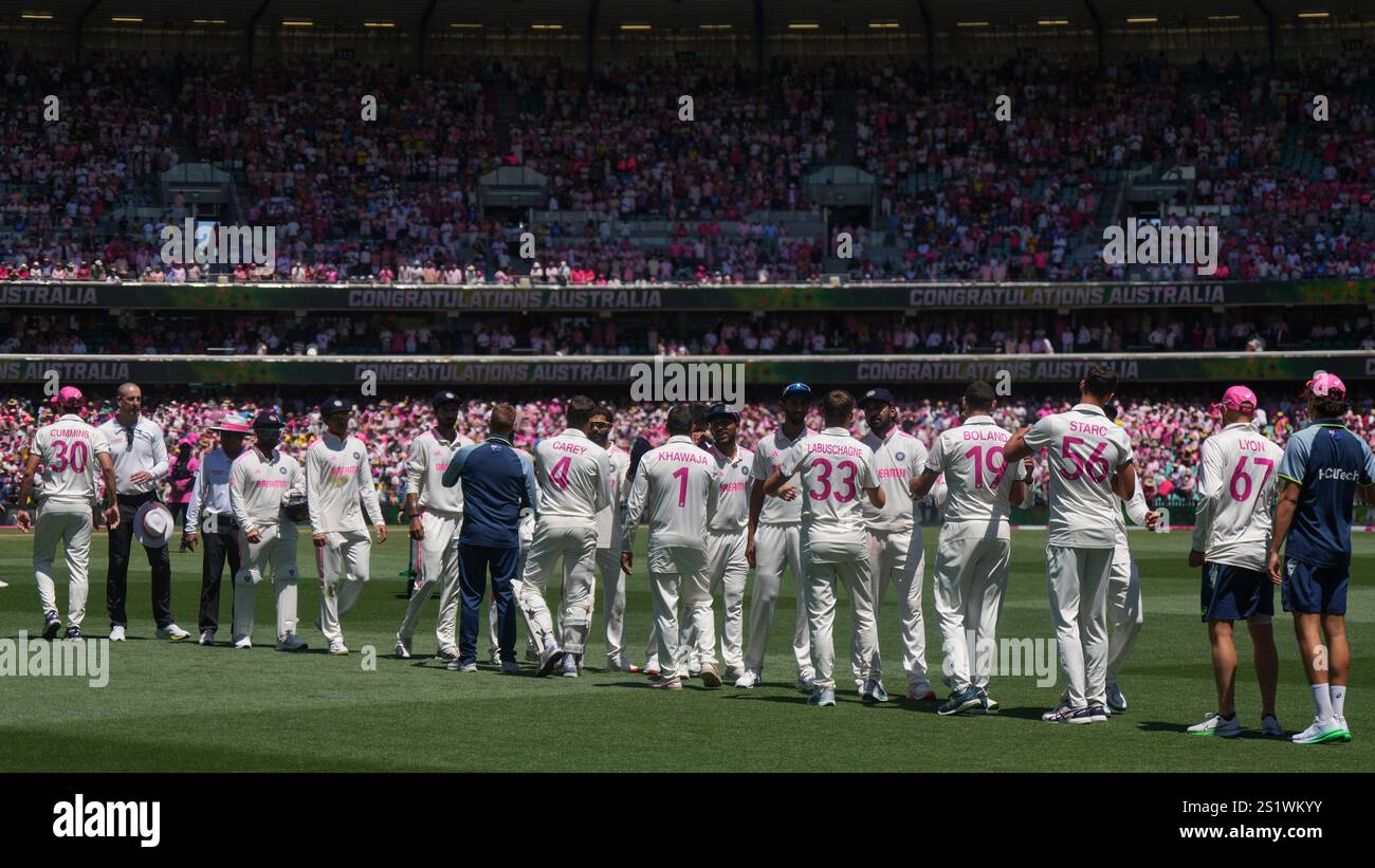 Australian and Indian players shake hands at the end of play in the ...