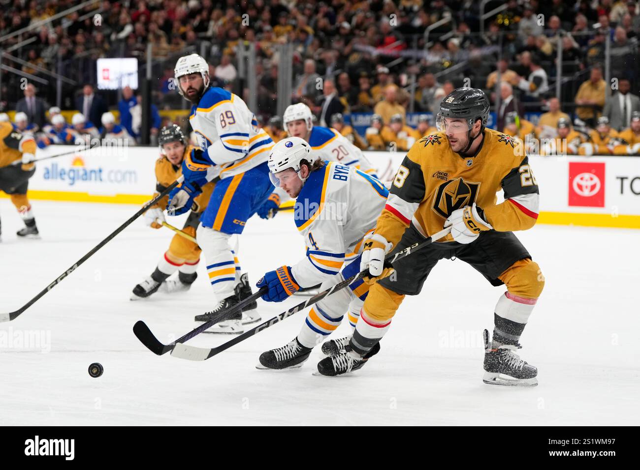 Buffalo Sabres defenseman Bowen Byram (4) skates for the puck against ...