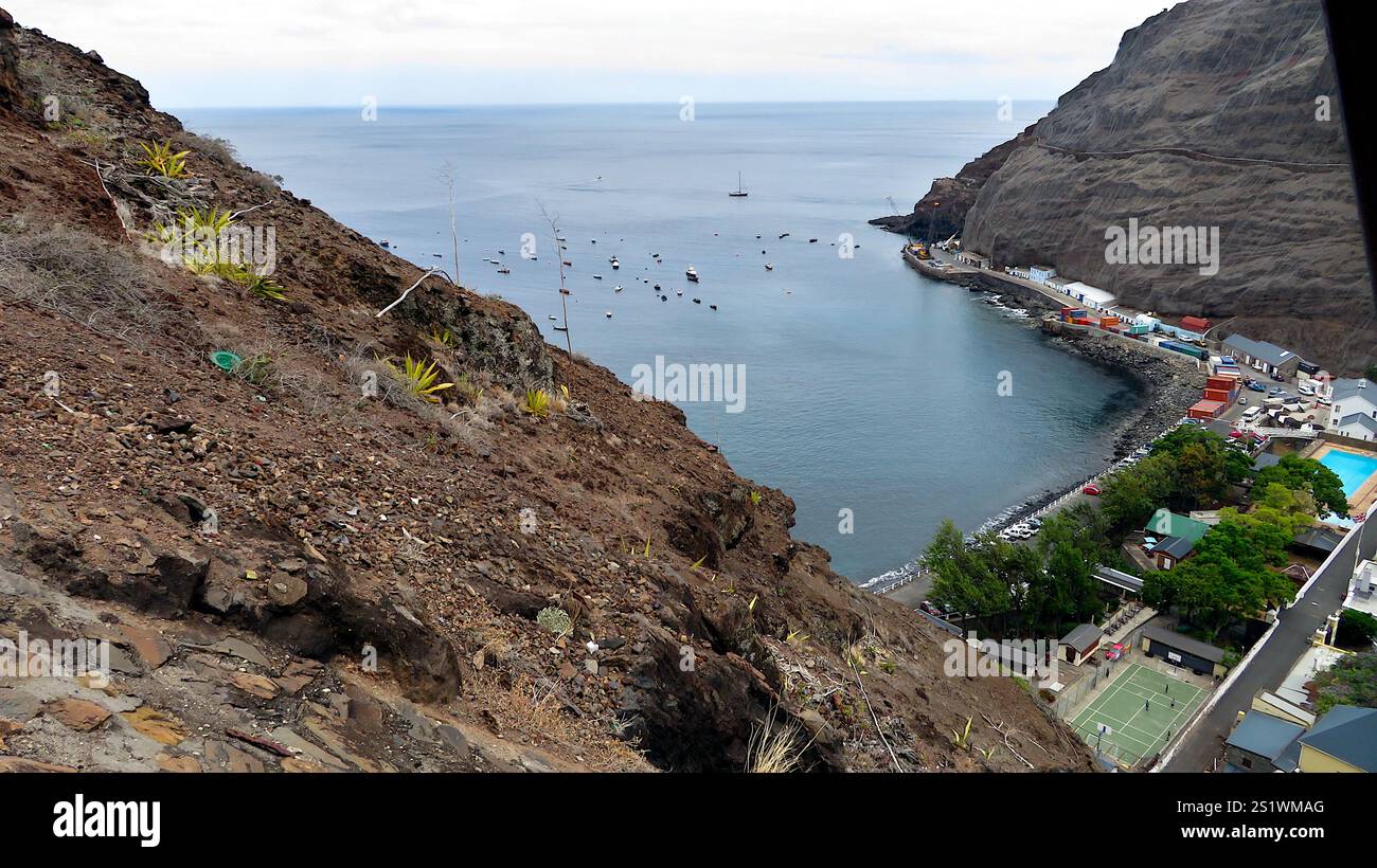 Saint Helena's dramatic coastline with steep cliffs, a peaceful bay ...