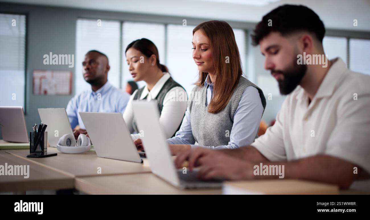 Diverse College Students Group In Classroom With Laptop Computers Stock ...