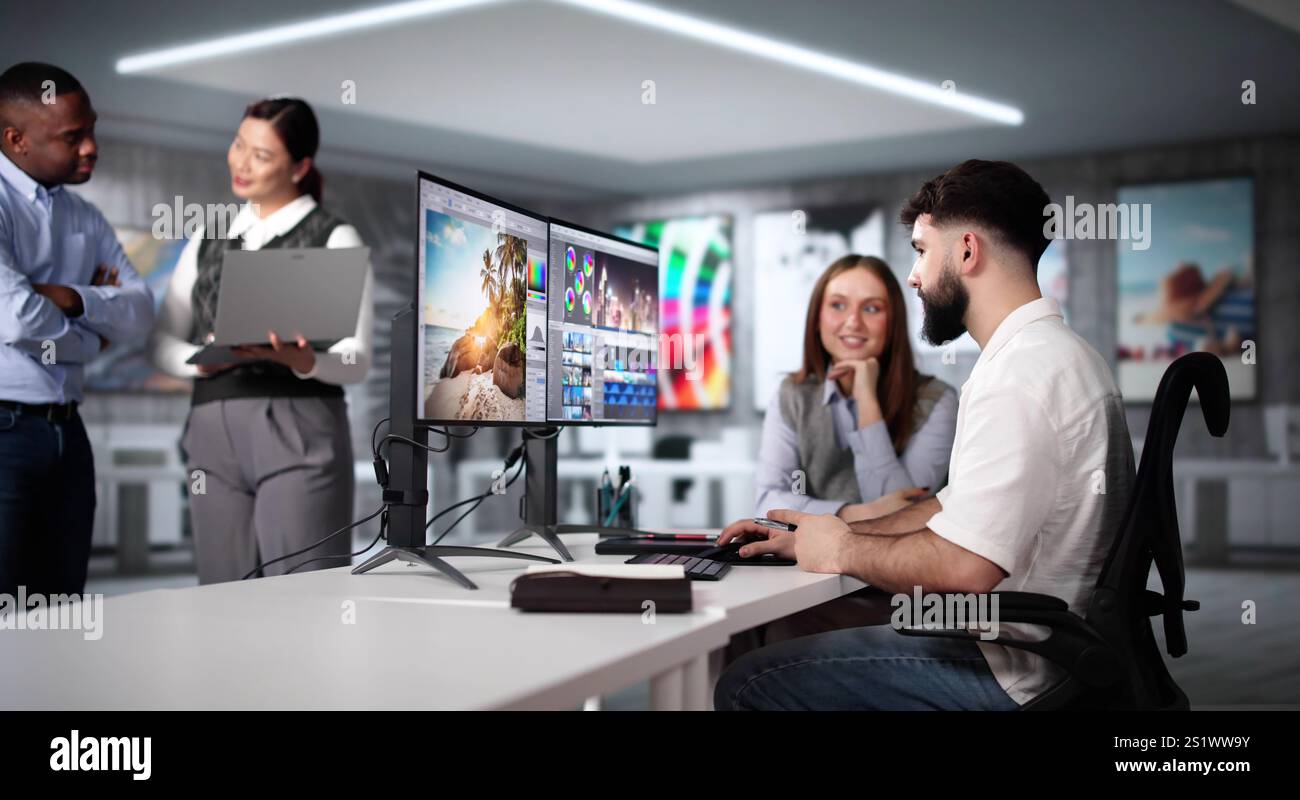 Graphic Designer Artist Team Working On Multiple Computer Screens Stock ...