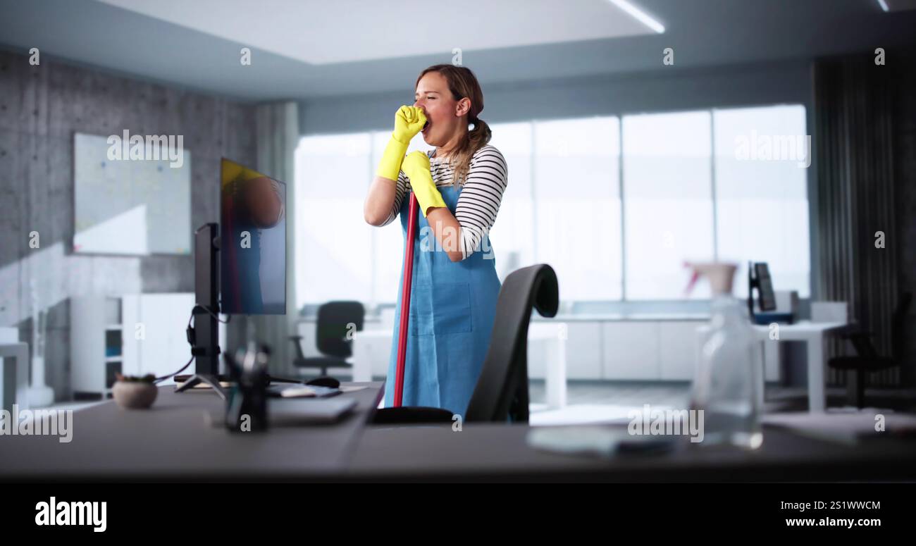 Caucasian Tired Office Cleaning Janitor With Mop Stock Photo - Alamy