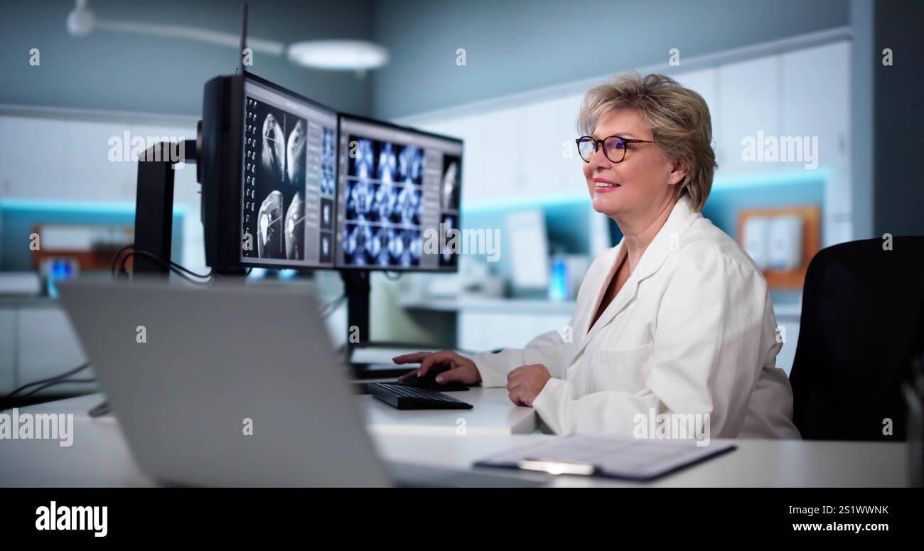 Radiologist Dentist Using X Ray Software On Desktop Computer Stock ...