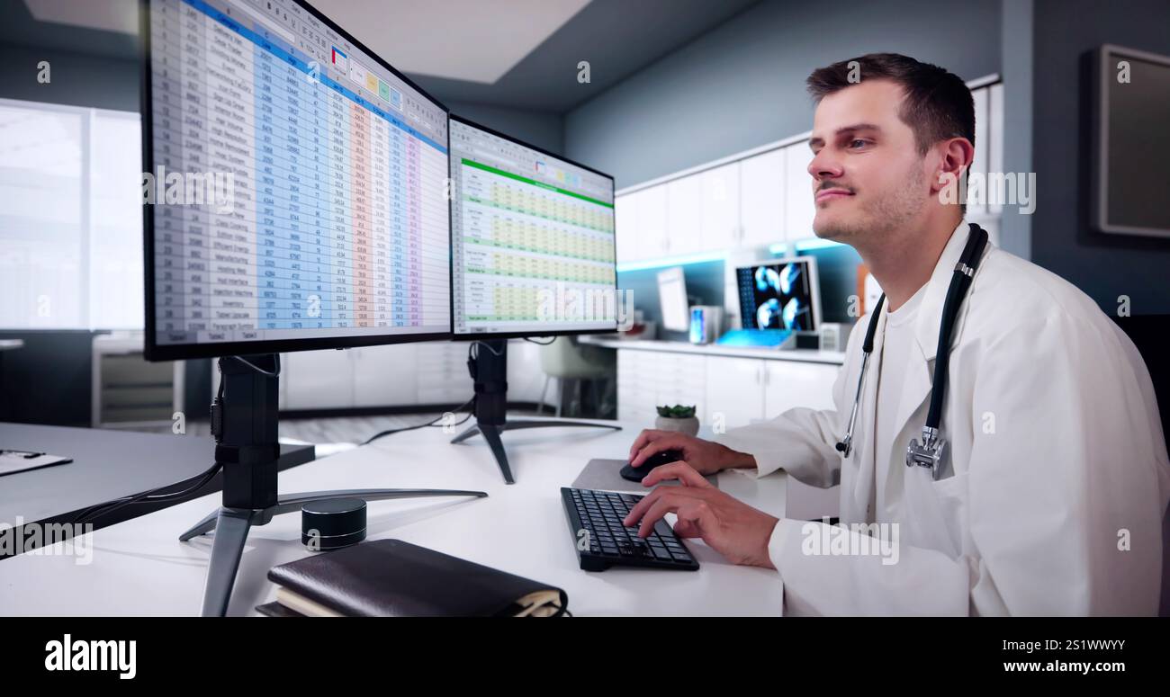 Hospital Doctor Using Spreadsheet For Billing Codes On Desktop Stock ...