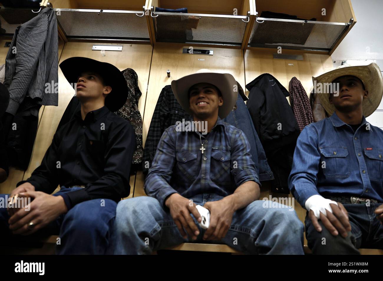 Riders prepare in the locker room PBR's Unleash The Beast buck off ...