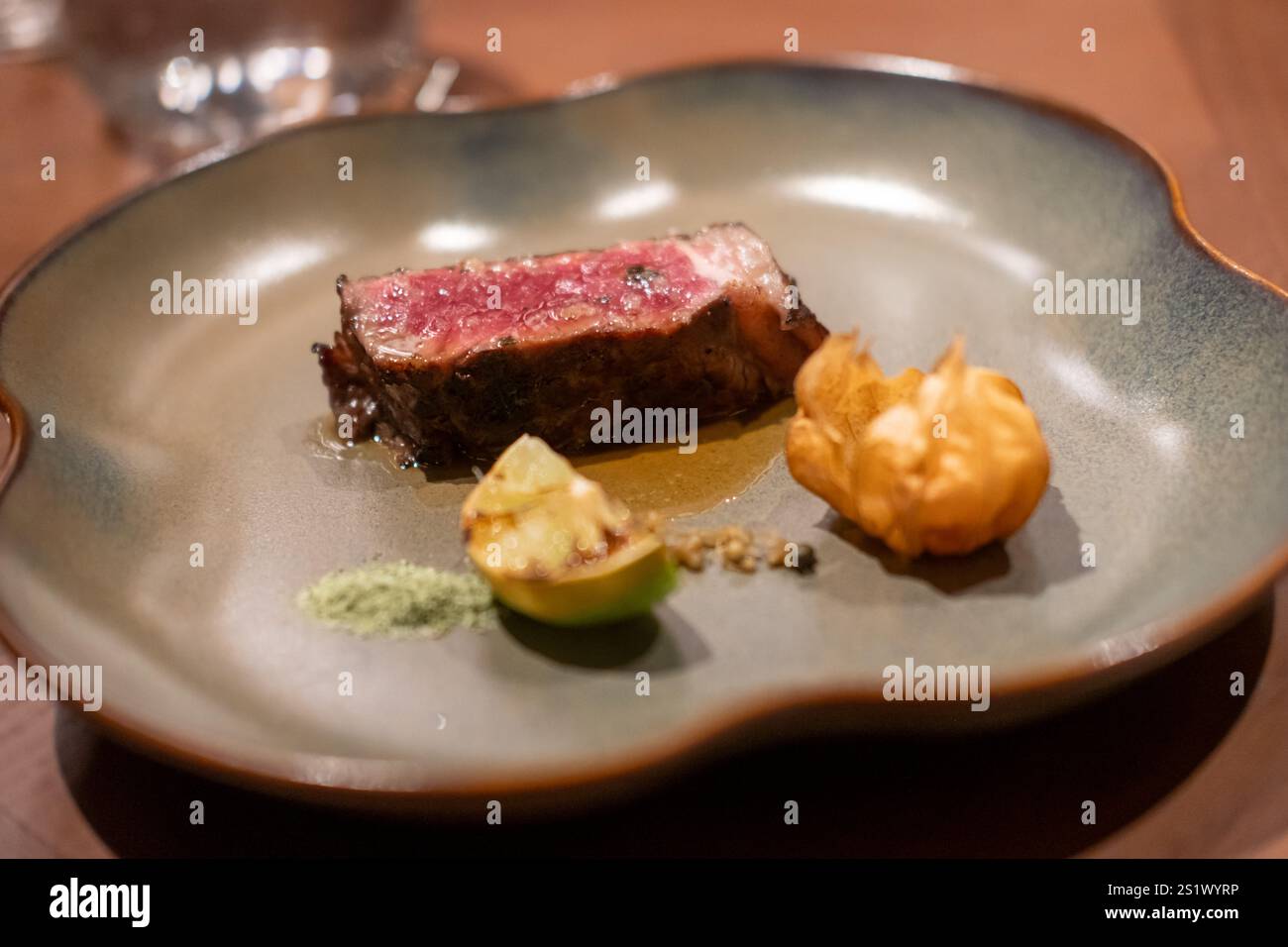 Medium rare Wagyu beef on plate Stock Photo - Alamy