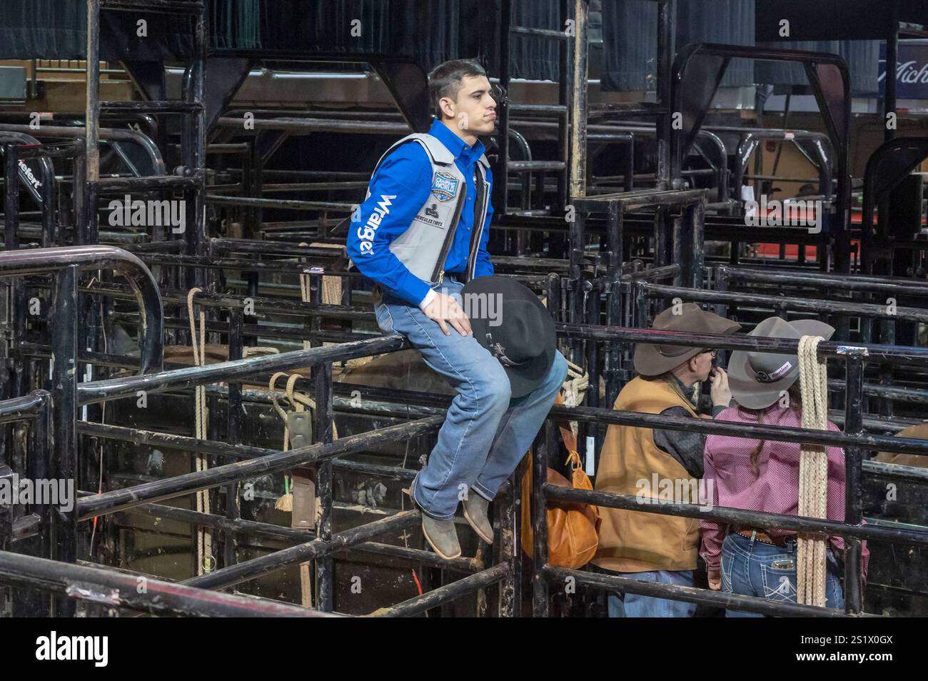 NEW YORK, NEW YORK - JANUARY 04: A rider relaxes in the bull pen area ...