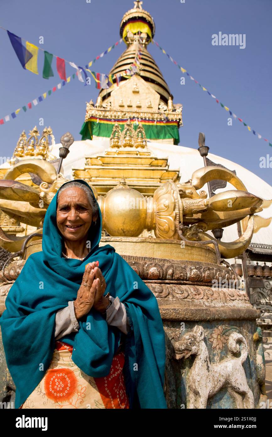 Nepali woman with hands together giving Namaste, sometimes called ...