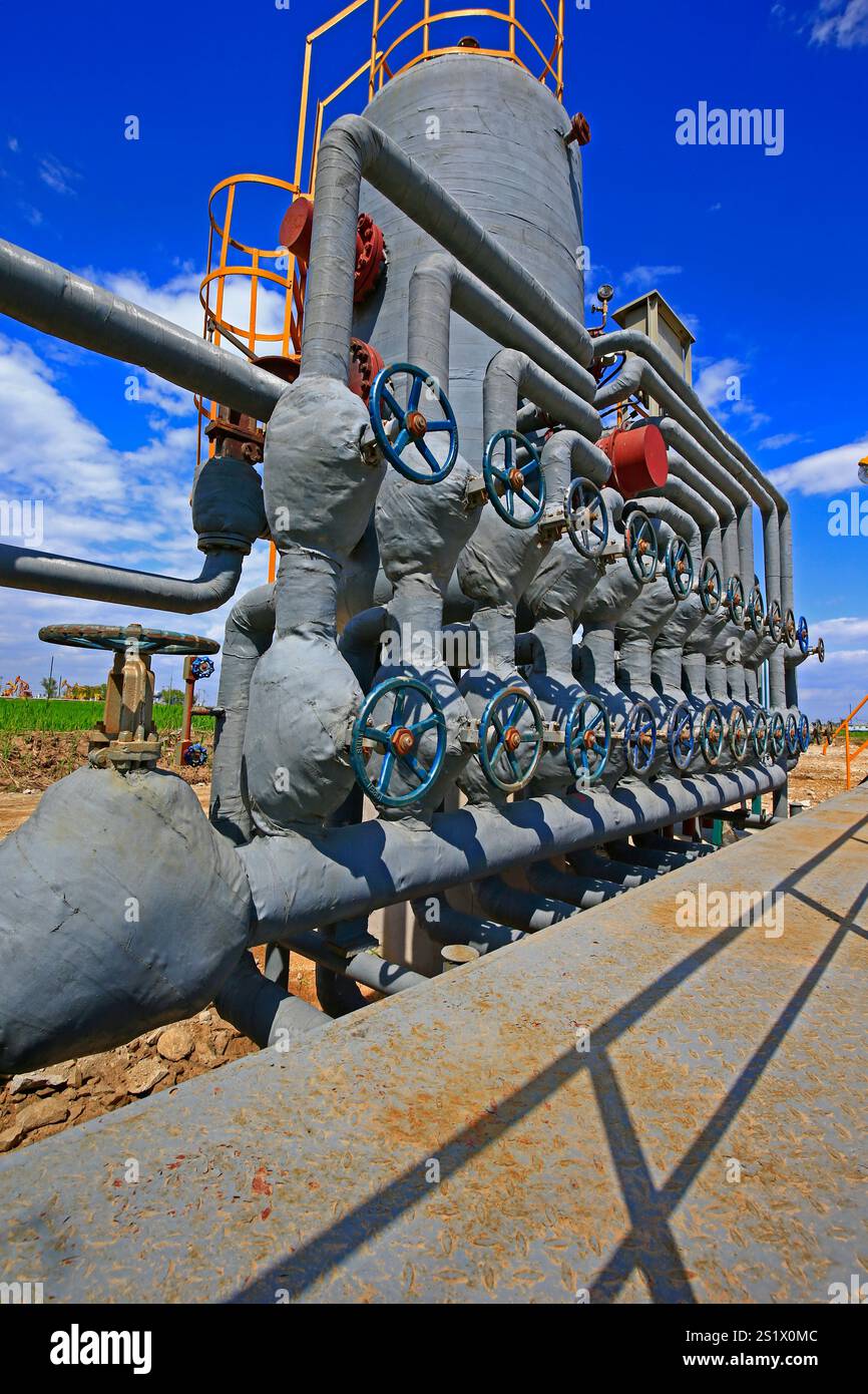 Oil pipes and valves Stock Photo - Alamy