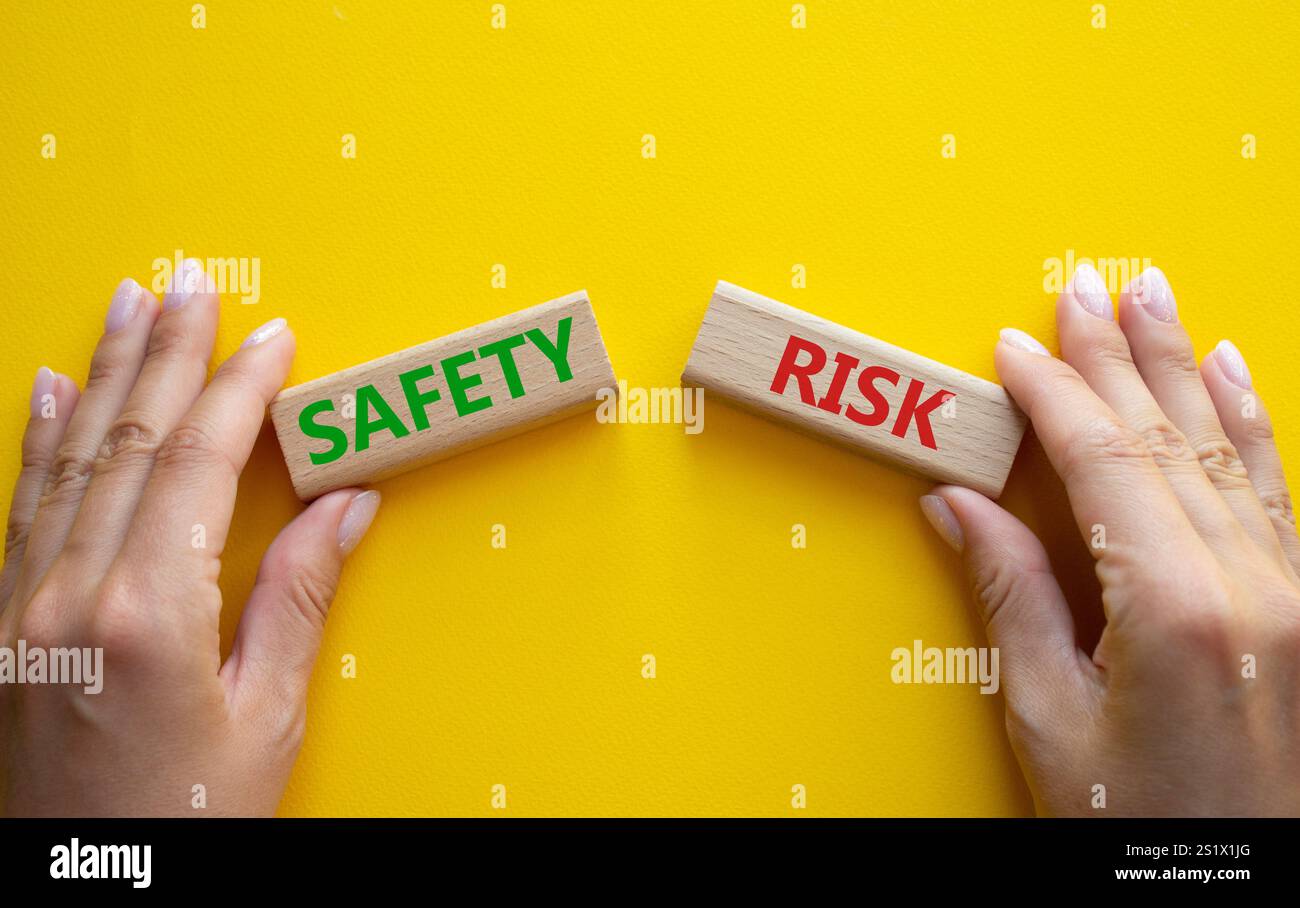 Safety or Risk symbol. Concept word Safety or Risk on wooden blocks ...