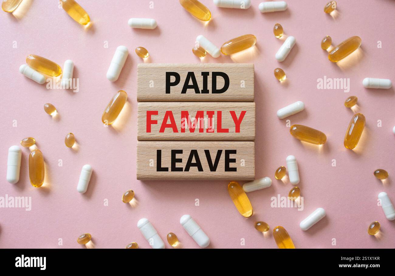 Paid Family Leave symbol. Concept words Paid Family Leave on wooden ...