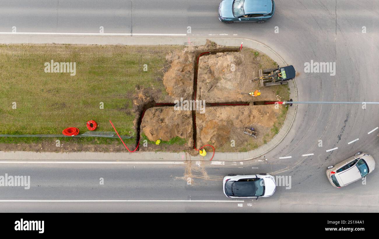 Aerial view of roadside construction with trenches and vehicles Stock ...