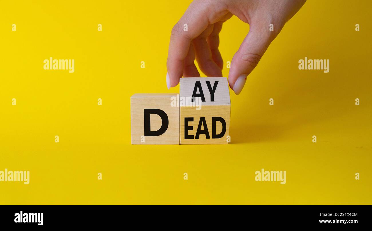 Day of the Dead symbol. Businessman hand turns wooden cubes and changes ...
