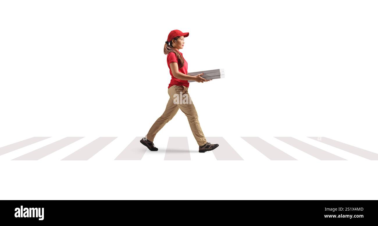 Food delivery woman carrying pizza boxes and crossing a street isolated ...