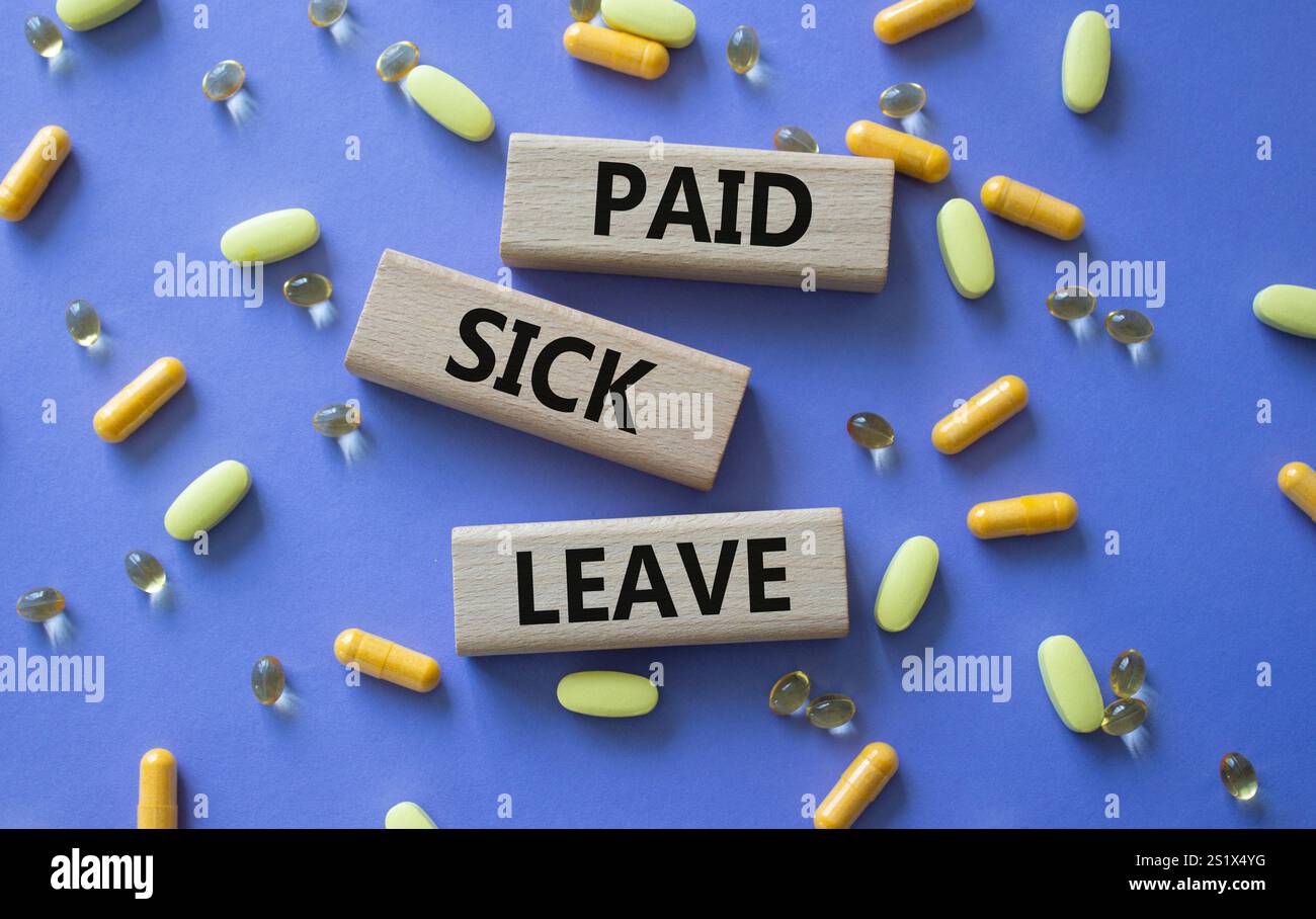 Paid Sick Leave symbol. Concept words Paid Sick Leave on wooden blocks ...