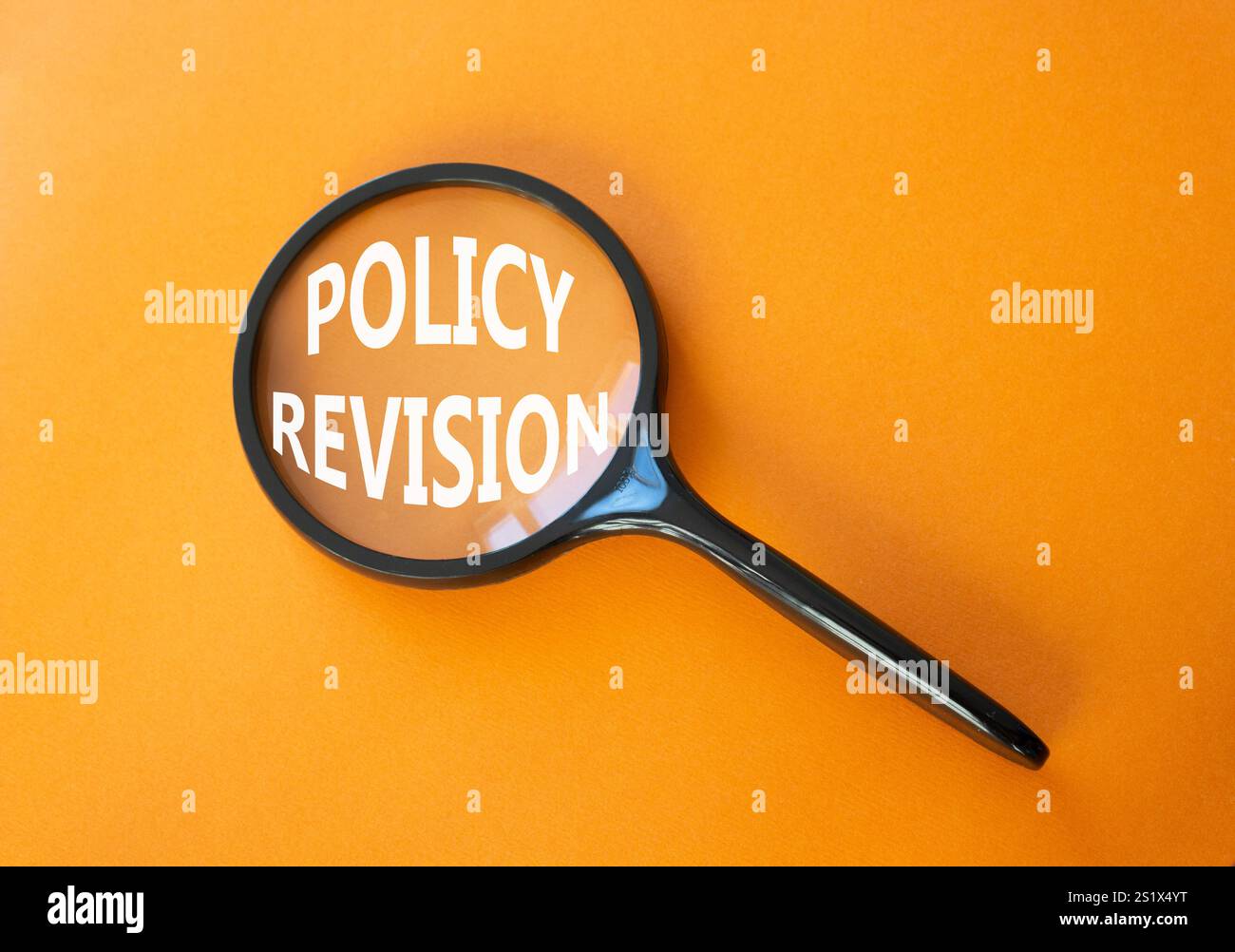 Policy revision symbol. Concept word Policy revision on magnifying ...