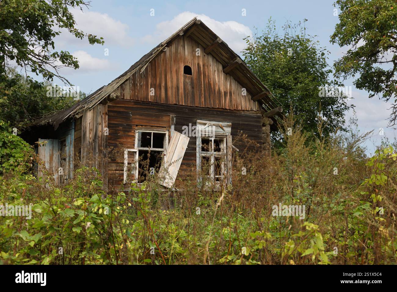 Old abandoned decrepit wooden house in a Russian remote village at summer Stock Photo - Alamy