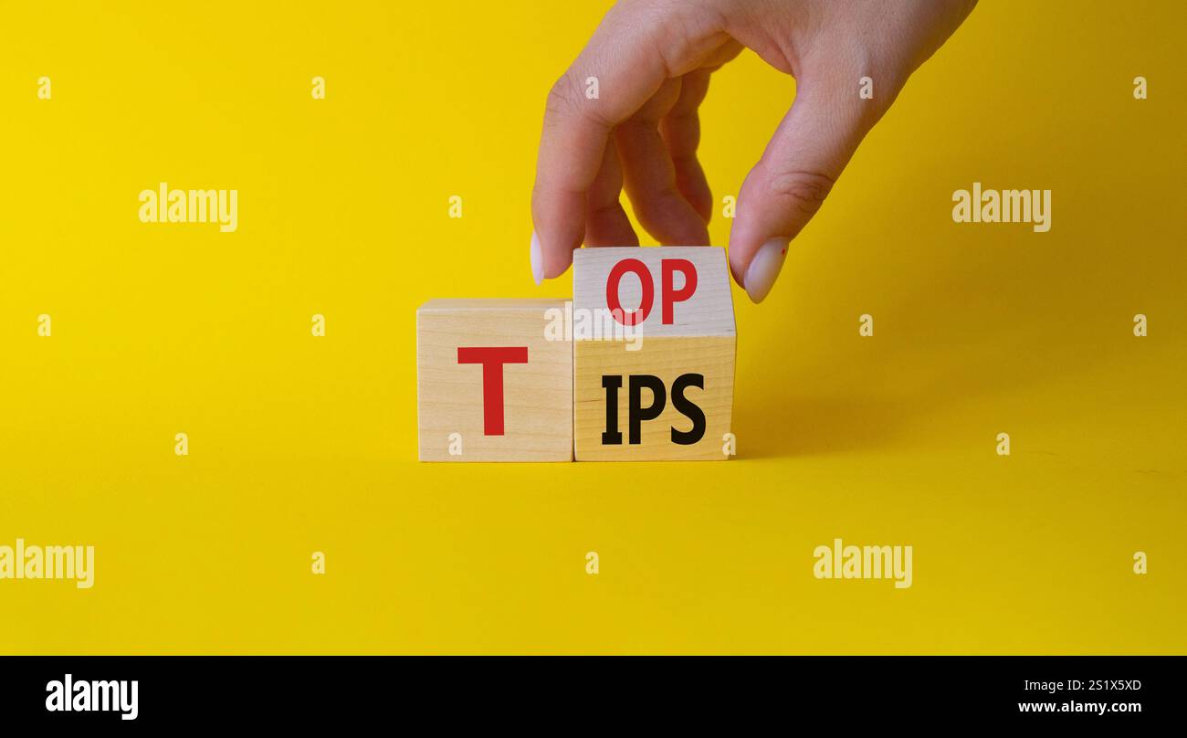 Top Tips symbol. Businessman hand Turnes cubes with words Top Tips ...