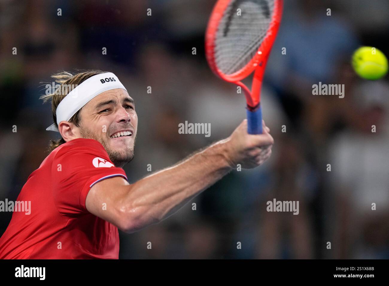 Taylor Fritz of the U.S. hits a forehand to Poland's Hubert Hurkacz ...