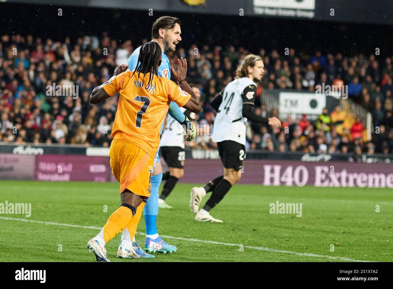 Vinicius Junior of Real Madrid and Stole Dimitrievski of Valencia CF ...