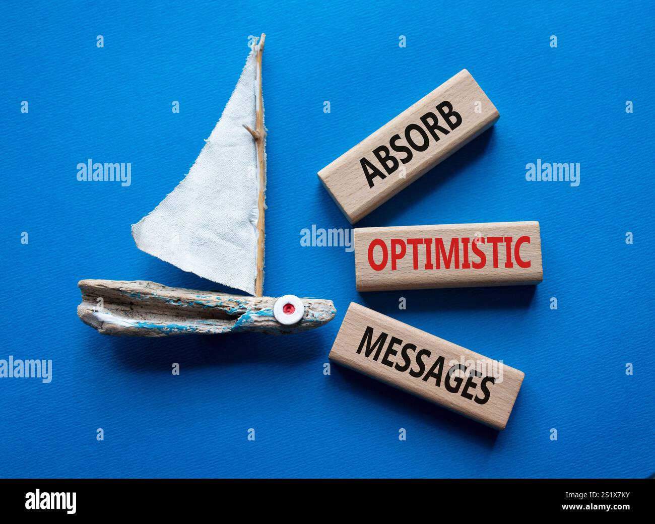 Absorb optimistic Messages symbol. Concept words Absorb optimistic Messages on wooden blocks ...