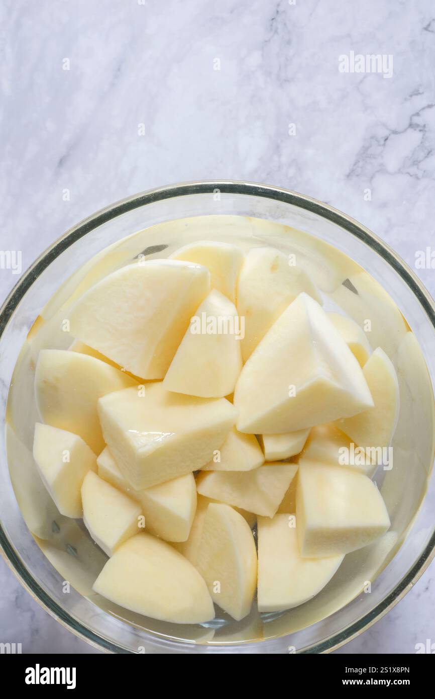 Sliced potatoes soaking in hi-res stock photography and images - Alamy