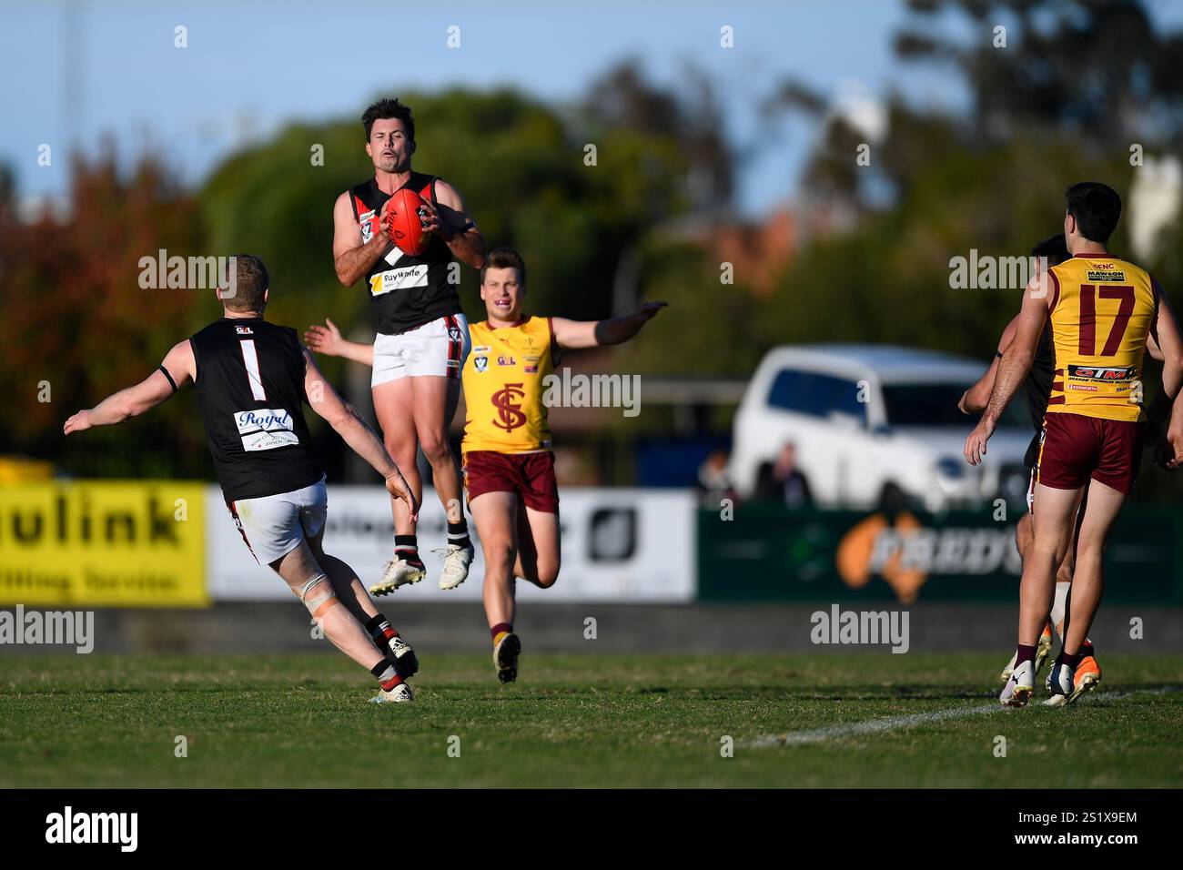 Australian Rules Football player Chris Welsh of Benalla Saints leaps in ...