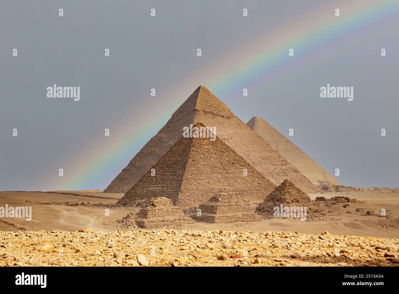 Egypt. Cairo - Giza. Rainbow over the pyramids. General view of ...