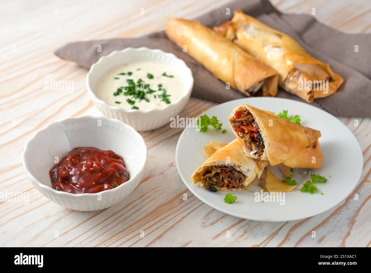 Crispy spring rolls from filo pastry stuffed with spicy vegetables and ...