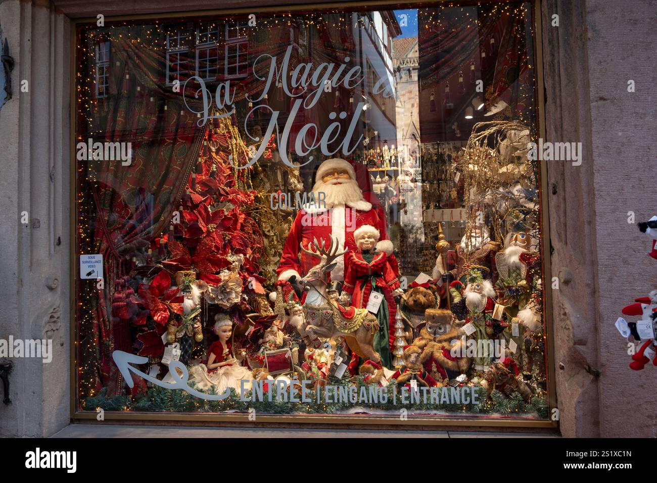 Christmas window display with Santa Claus, reindeer and gnomes of a ...
