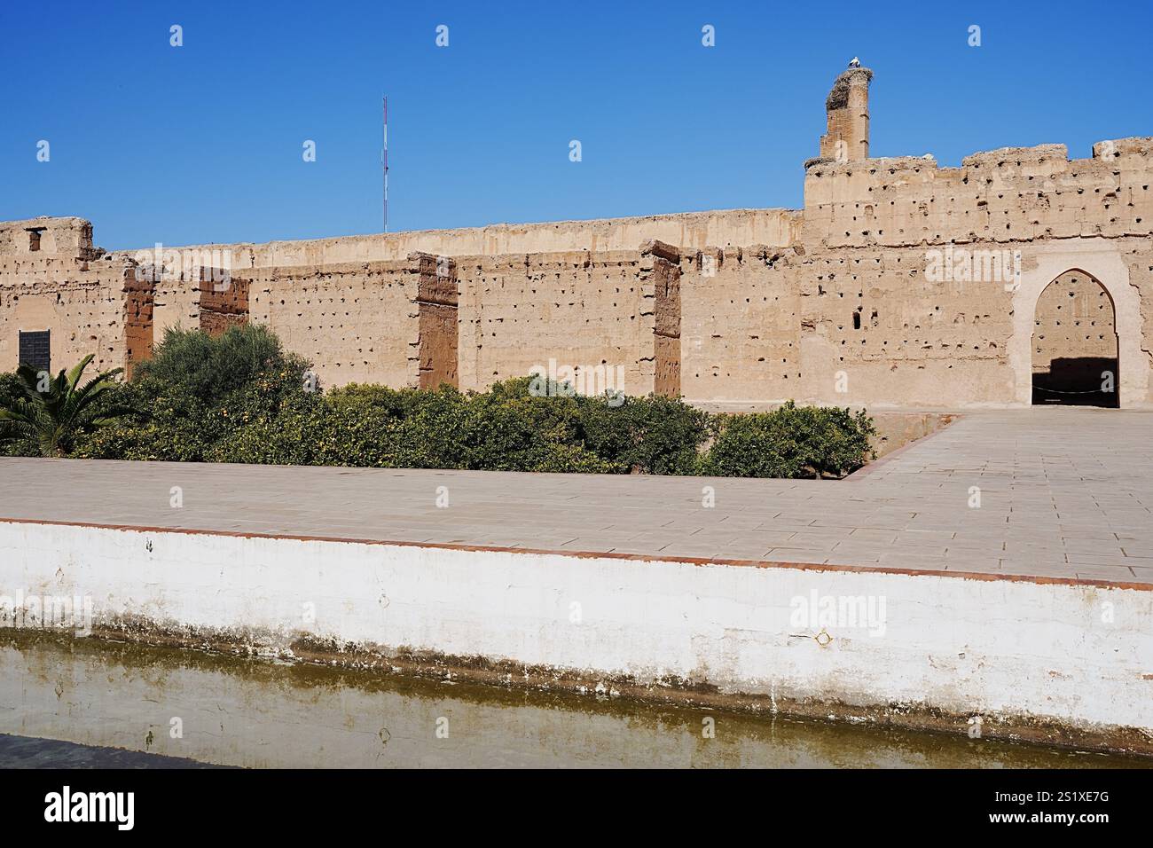 Scenic El Badi palace reflected in water in African MARRAKESH city in ...