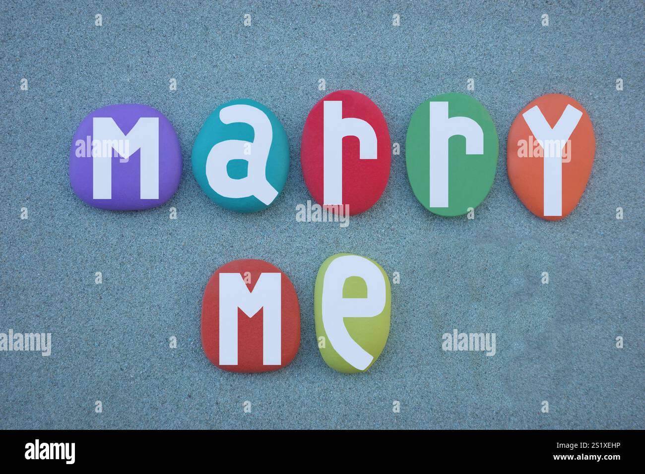 Marry me, creative love message composed with multi colored hand ...