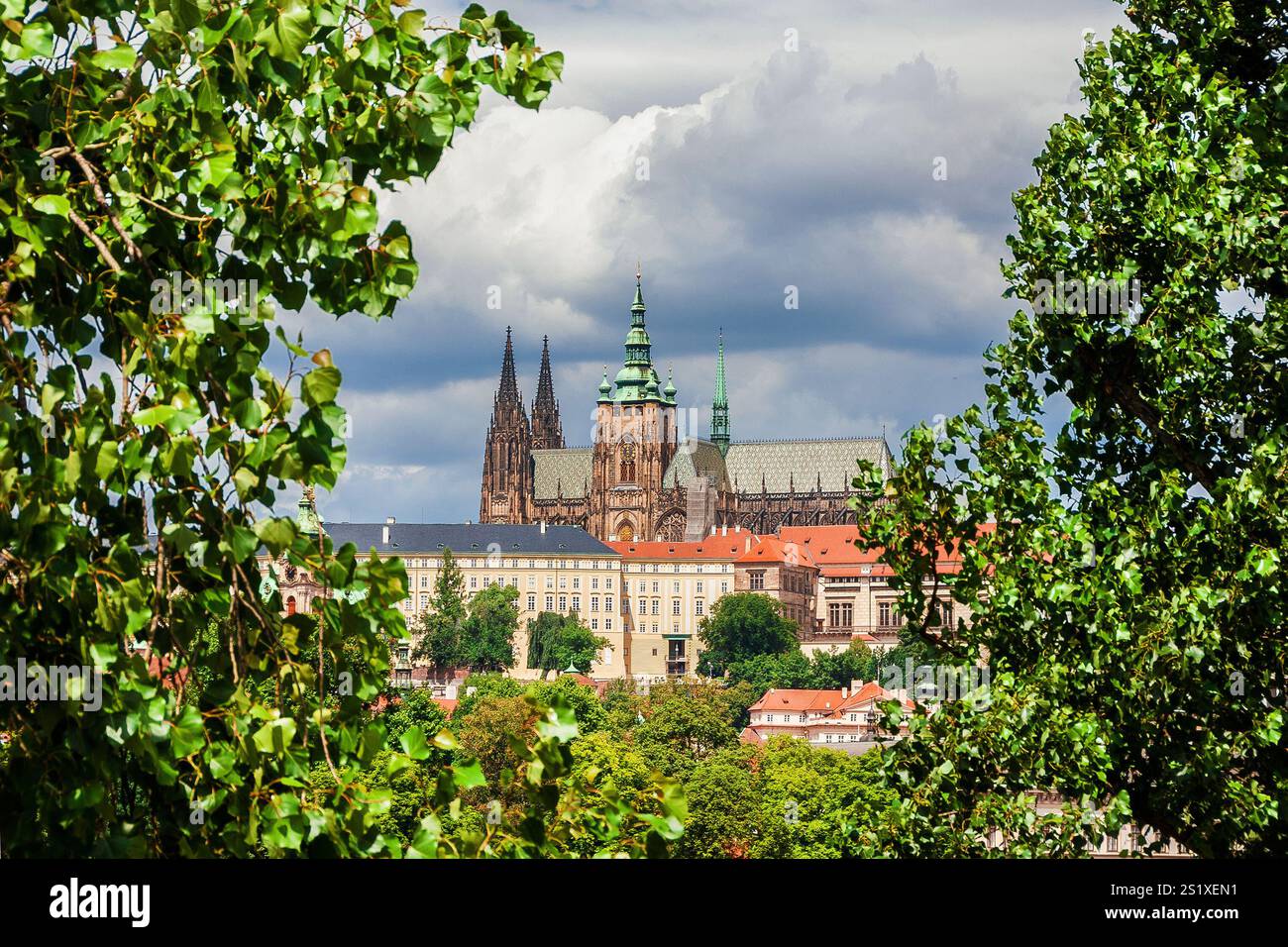St. Vitus Cathedral, beautiful gothic church in Prague, among green ...