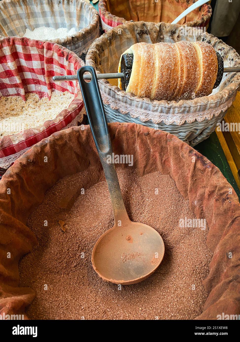 Traditional chimney cake, trdelník with baskets of flavors ...