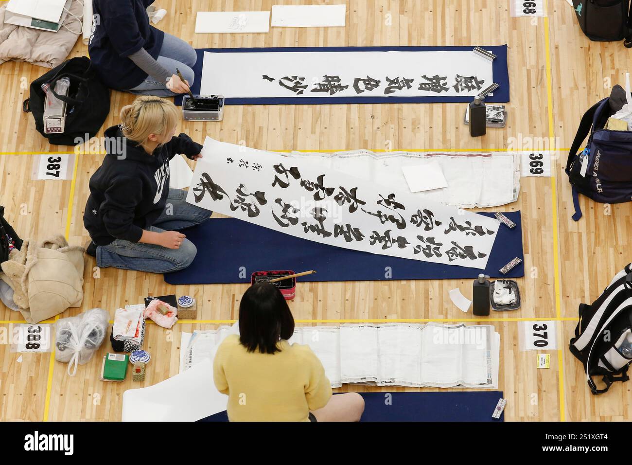 Participants write characters during the annual Kakizome (first ...