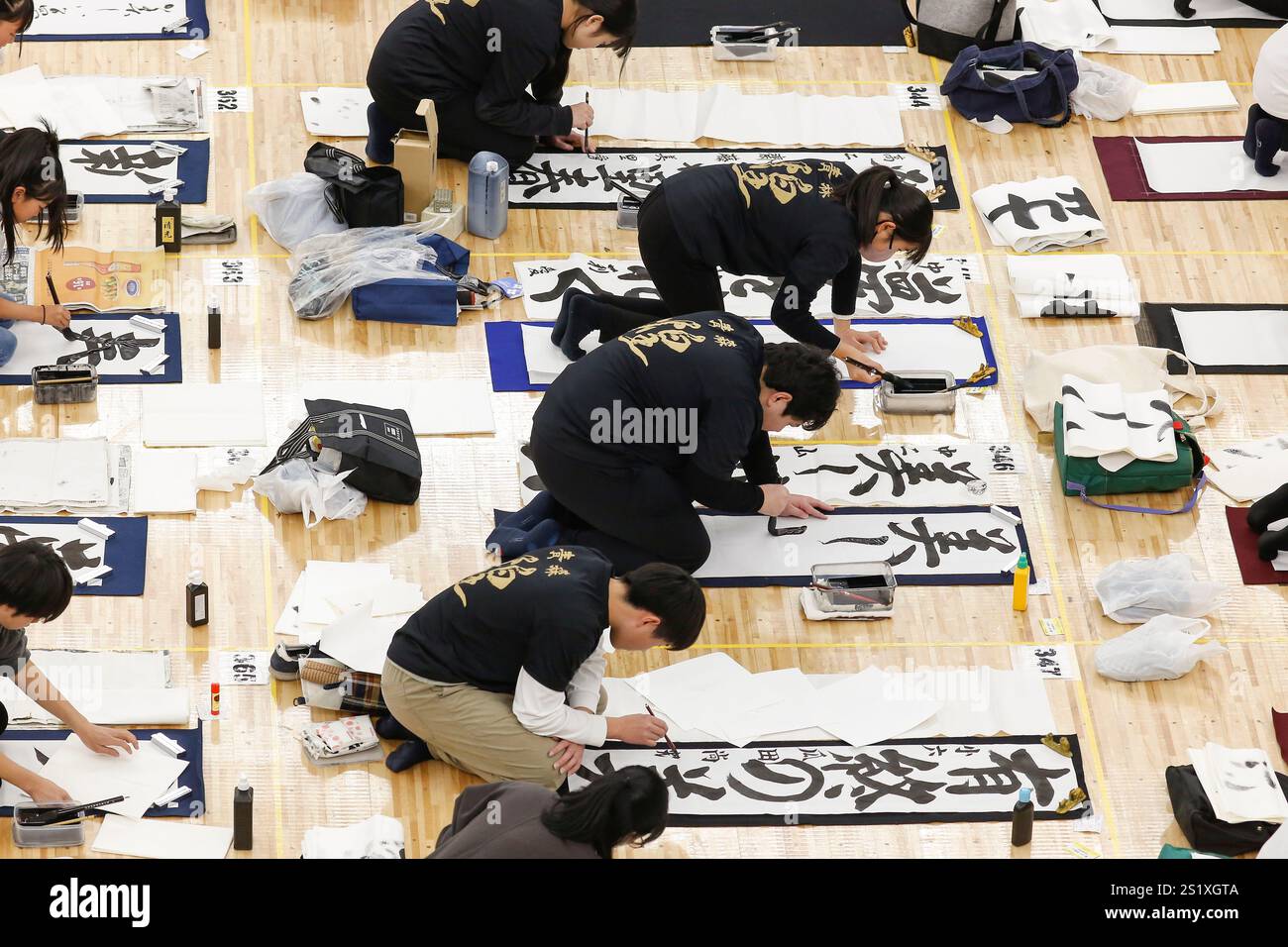 Participants write characters during the annual Kakizome (first ...