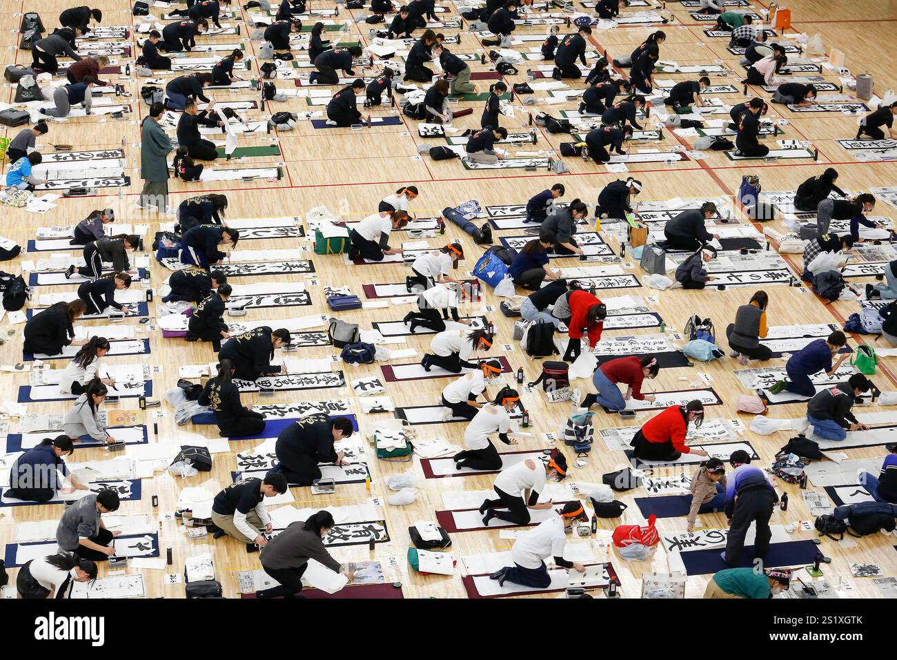 Participants write characters during the annual Kakizome (first ...