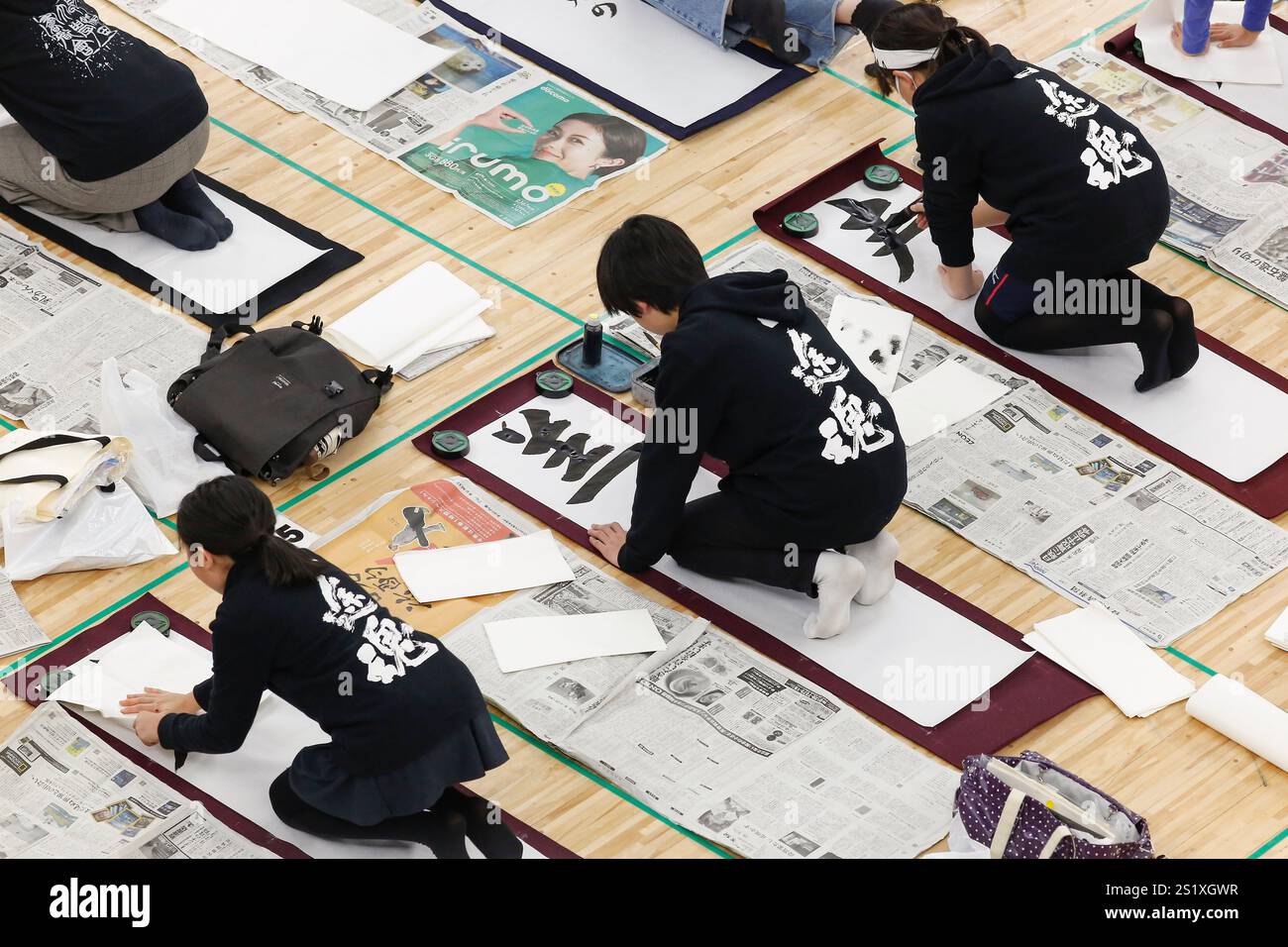Participants write characters during the annual Kakizome (first ...