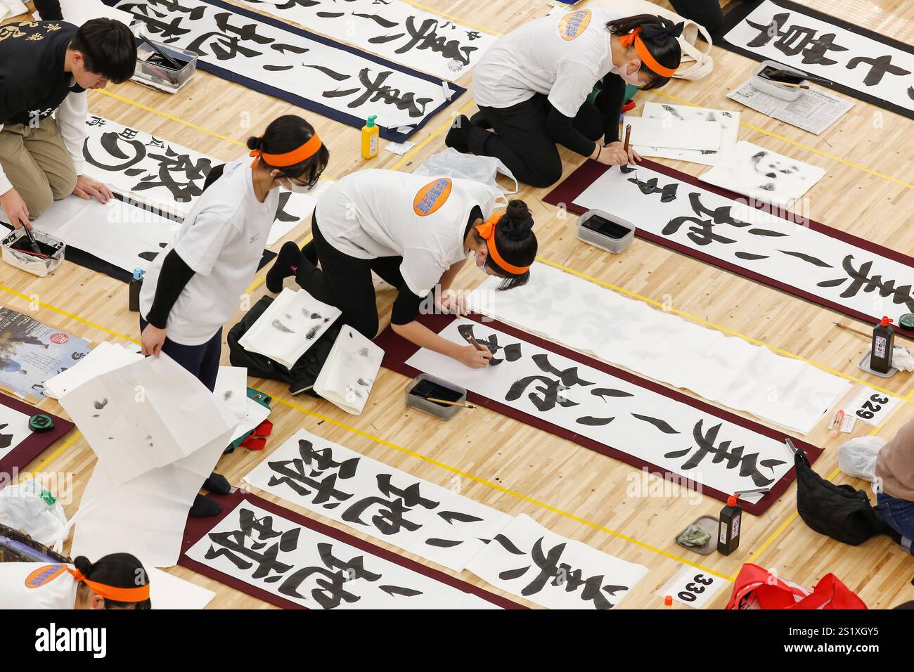 Participants write characters during the annual Kakizome (first ...