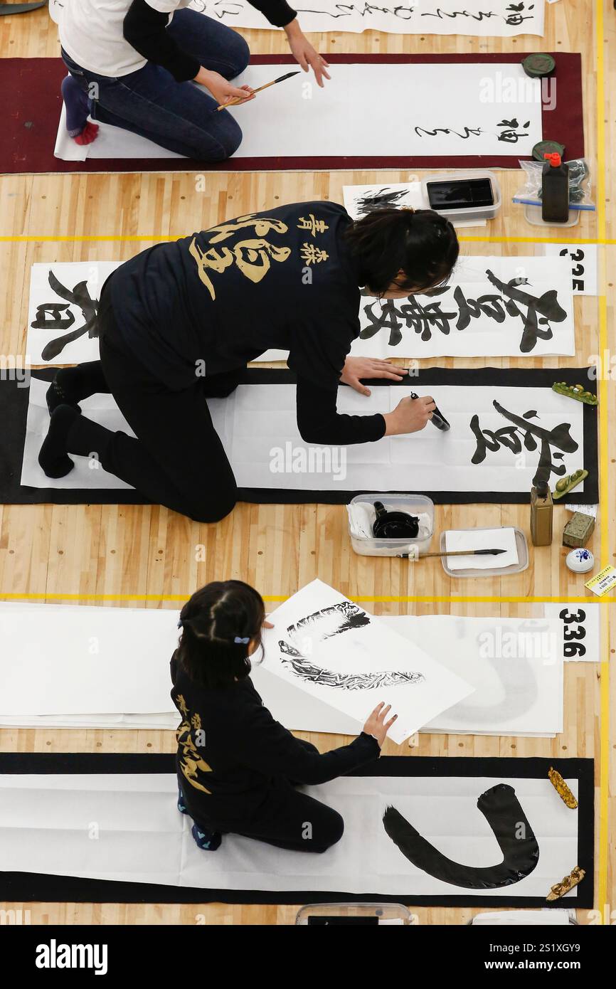 Participants write characters during the annual Kakizome (first ...