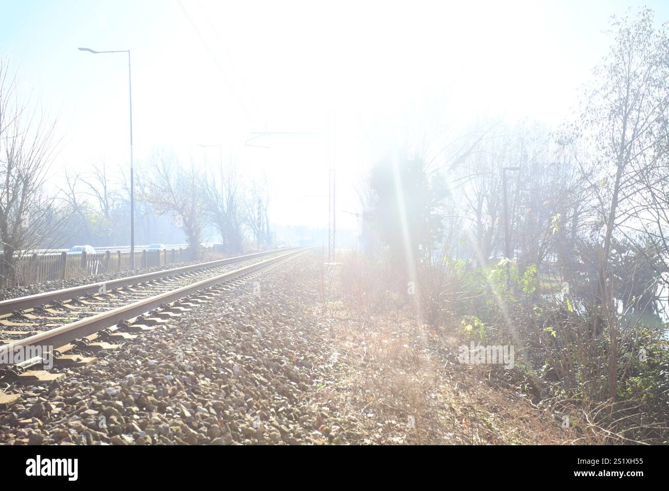Railroad track on an embankment over a park by the lakeshore on a ...