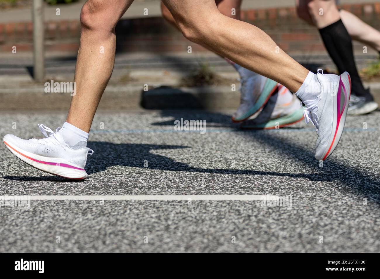 Legs of runners in a marathon Stock Photo - Alamy