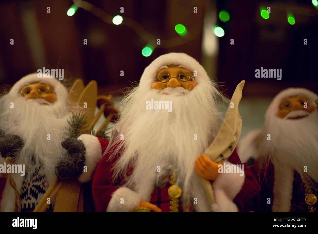 Christmas toy store. Mini Santa Clauses on display Stock Photo - Alamy