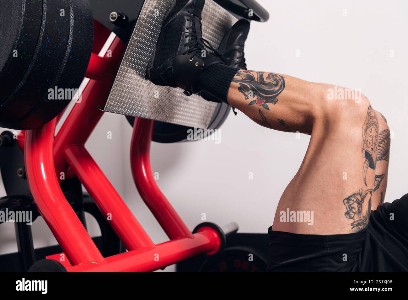 legs of muscular sportsman training at gym Stock Photo - Alamy
